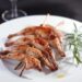 Honey glazed quail leg skewers